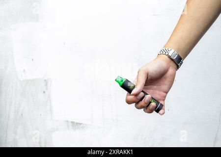 Hand Holding Black Vape Device. Pod Kits, Pod Mods, Pod Vapes ...