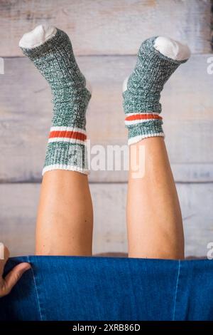 Feet with socks. Exercise on the home mat with fitness accessories such ...