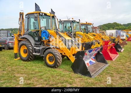 Line up of old diggers at a festival Stock Photo - Alamy