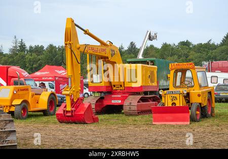 Line up of old diggers at a festival Stock Photo - Alamy