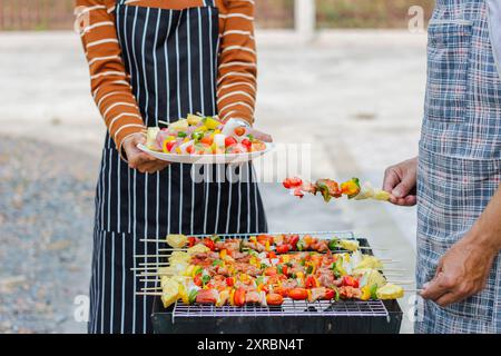 Blurred images , A group of colleagues held a barbecue party. (BBQ ...