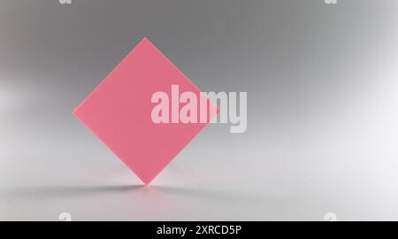 Pink blank paper rhombus on gray background, notepad Stock Photo - Alamy