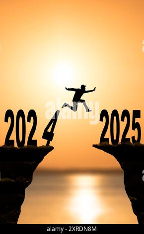 2025 year concept. Silhouettes of active people in nature against the ...