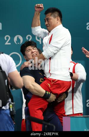 Liu Huanhua of China reacts after a good lift during the men's 102kg ...