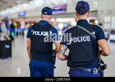 Larnaka, Cyprus. 10th Aug, 2024. Armed police officers patrol the ...