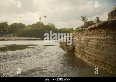 Alluvium along the riverbank is affected by river current abrasion and ...