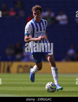 Brighton and Hove Albion's Mats Wieffer (centre) celebrates with team ...