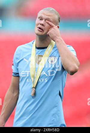 Erling Haaland of Manchester City wipes his face during the Premier ...