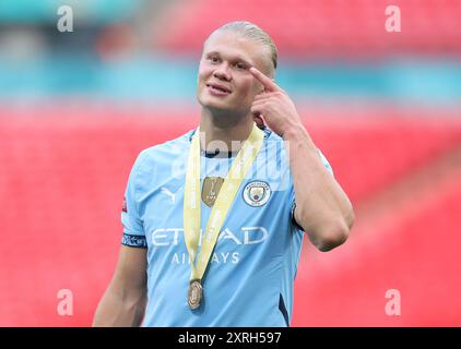 Erling Haaland of Manchester City wipes his face during the Premier ...