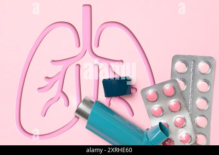 Asthma inhaler, drugs and illustration of lungs on pink background ...