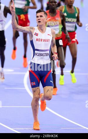 PARIS, FRANCE - AUGUST 10: Jakob Ingebrigtsen of Norway wins the Gold and rings the bell during ...