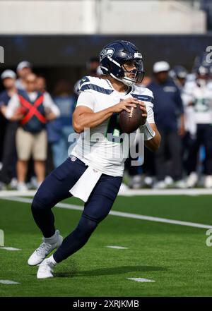 Seattle Seahawks quarterback Sam Howell makes throws on the sideline ...
