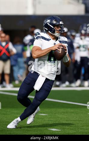 Seattle Seahawks quarterback Sam Howell warms up before an NFL football ...