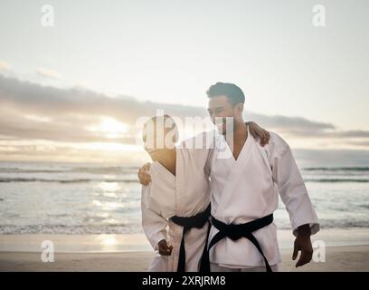 Happy people, friends and karate with hug on beach for martial arts ...
