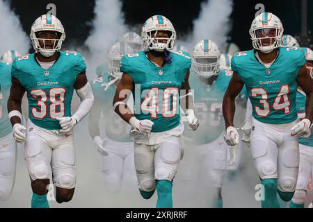 Miami Dolphins safety Jordan Colbert (34) tackles Chicago Bears wide ...