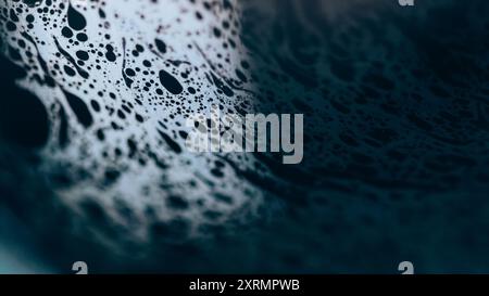 Defocused light fluid. Gasoline emulsion. Green blue purple color ink ...