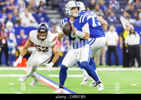 Denver Broncos quarterback Sam Ehlinger (--) takes part in drills ...