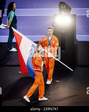 PARIS - Athlete Femke Bol and track cyclist Harrie Lavreysen carry the ...