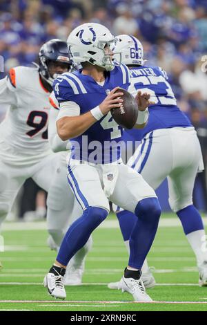 Denver Broncos quarterback Sam Ehlinger runs for a gain against the New ...