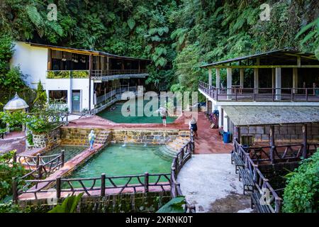 Visitors enjoying pools fed by hot springs at Fuentes Georginas ...