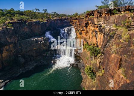 Upper cascades of Mitchell Falls, surrounded by sandstone cliffs in the ...