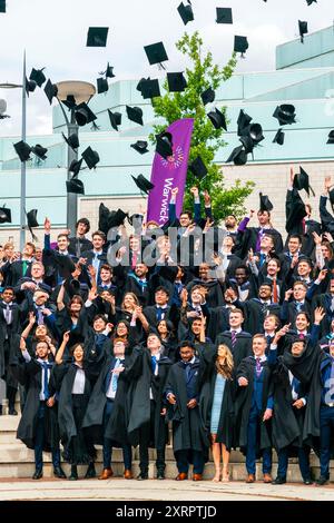 Group of graduates outside Warwick University after graduation ceremony ...