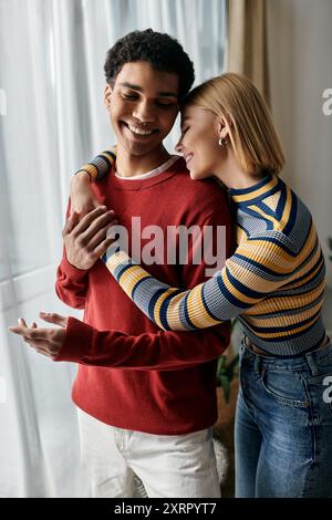 romantic relaxed young couple at modern home using tablet computer ...