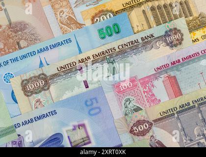 UAE currency notes of various denominations. UAE bank notes background ...