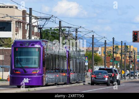 A Valley Metro Rail vehicle travels along Main Street in Mesa, Arizona ...