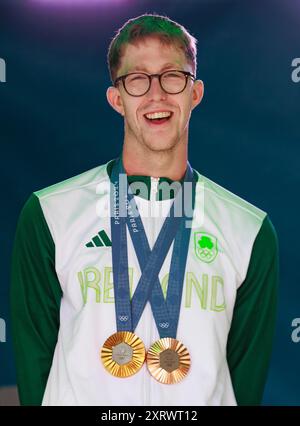 Ireland's Daniel Wiffen wears his Gold and Bronze medals onstage during ...