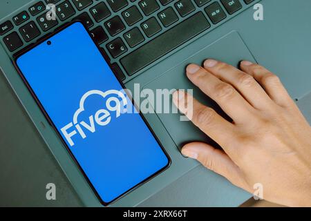 In this photo illustration, the Five9 logo is seen displayed on a ...