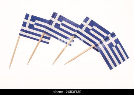 Small paper flags of Greece isolated on white Stock Photo - Alamy