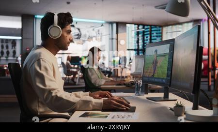 Indian Male Game Designer Using Desktop Computer With Green Screen ...