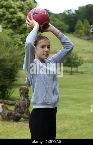 Girl playing netball practising shooting - sport aiming aim accuracy ...