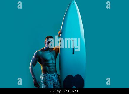 Handsome serfer man with serf board. Male fit with athletic body ...