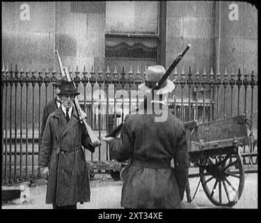 Photograph of soldiers sitting with their guns in the street during the ...