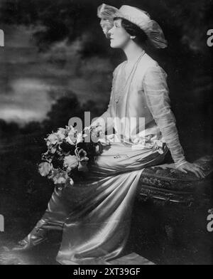 This portrait shows Mrs. A. Drexel Jr. in a wedding gown, holding a ...