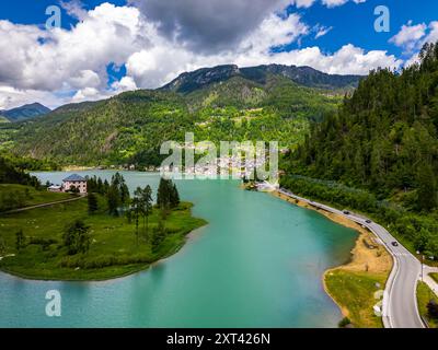 Aerial drone view of the Alleghe village with Lake Alleghe, in the ...