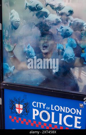 Banksy's police sentry box painted with piranhas by the artist as part ...