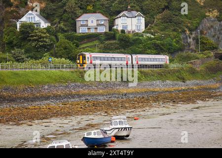Barmouth harbour houses and railway line Stock Photo - Alamy