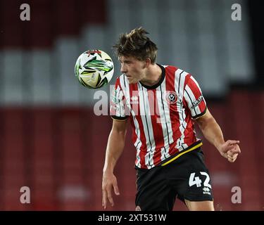 Sydie Peck of Sheffield United jumps up to win the high ball during the ...