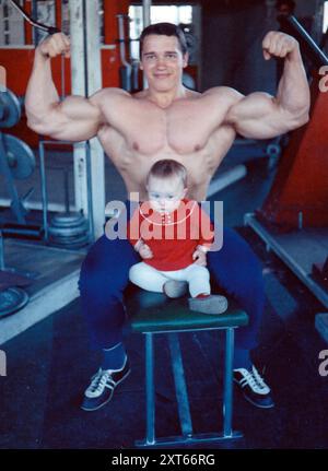 HOLLYWOOD LEGEND ARNOLD SCHWARZENEGGER WITH A YOUNG ADMIRER AT BOB ...