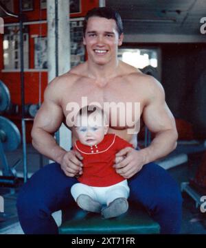 HOLLYWOOD LEGEND ARNOLD SCHWARZENEGGER WITH A YOUNG ADMIRER AT BOB ...