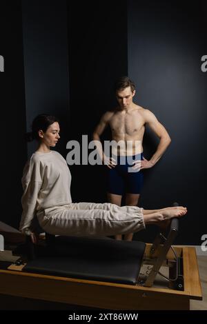 Sporty man doing exercises with pilates ball Stock Photo - Alamy