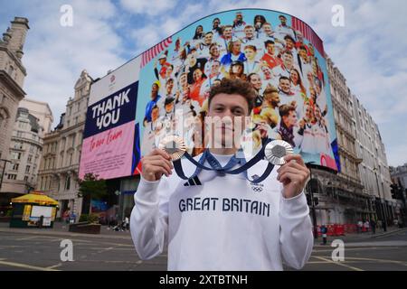 Diver Noah Williams poses with his Olympic medals in front of the ...