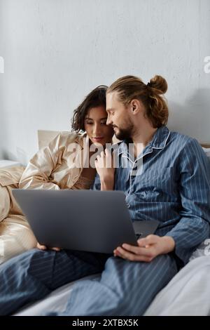 A loving couple cuddles in bed, sharing a tender moment Stock Photo - Alamy