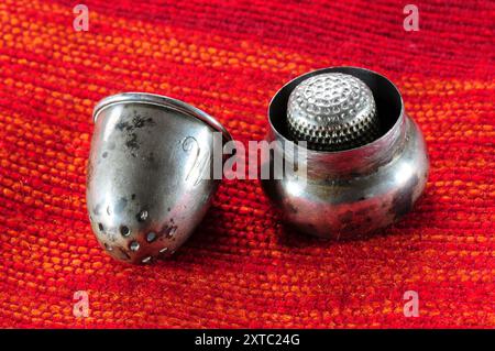 Antique silver thimble in two part silver case Stock Photo - Alamy