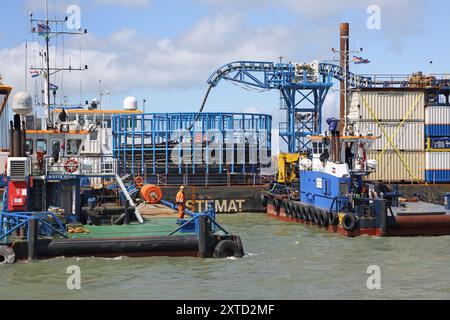 A cable laying barge installing a high voltage, sub-sea cable between ...