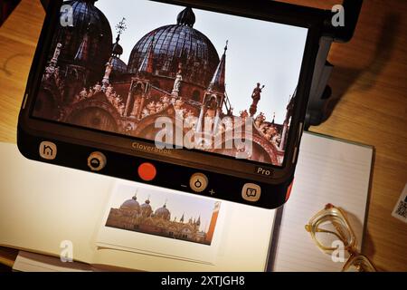 Digital enlargement using a low vision reading aid, a camera and built ...