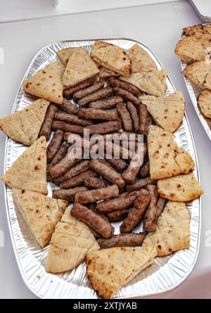 Free tasting of cevapi on Bascarsija Stock Photo - Alamy